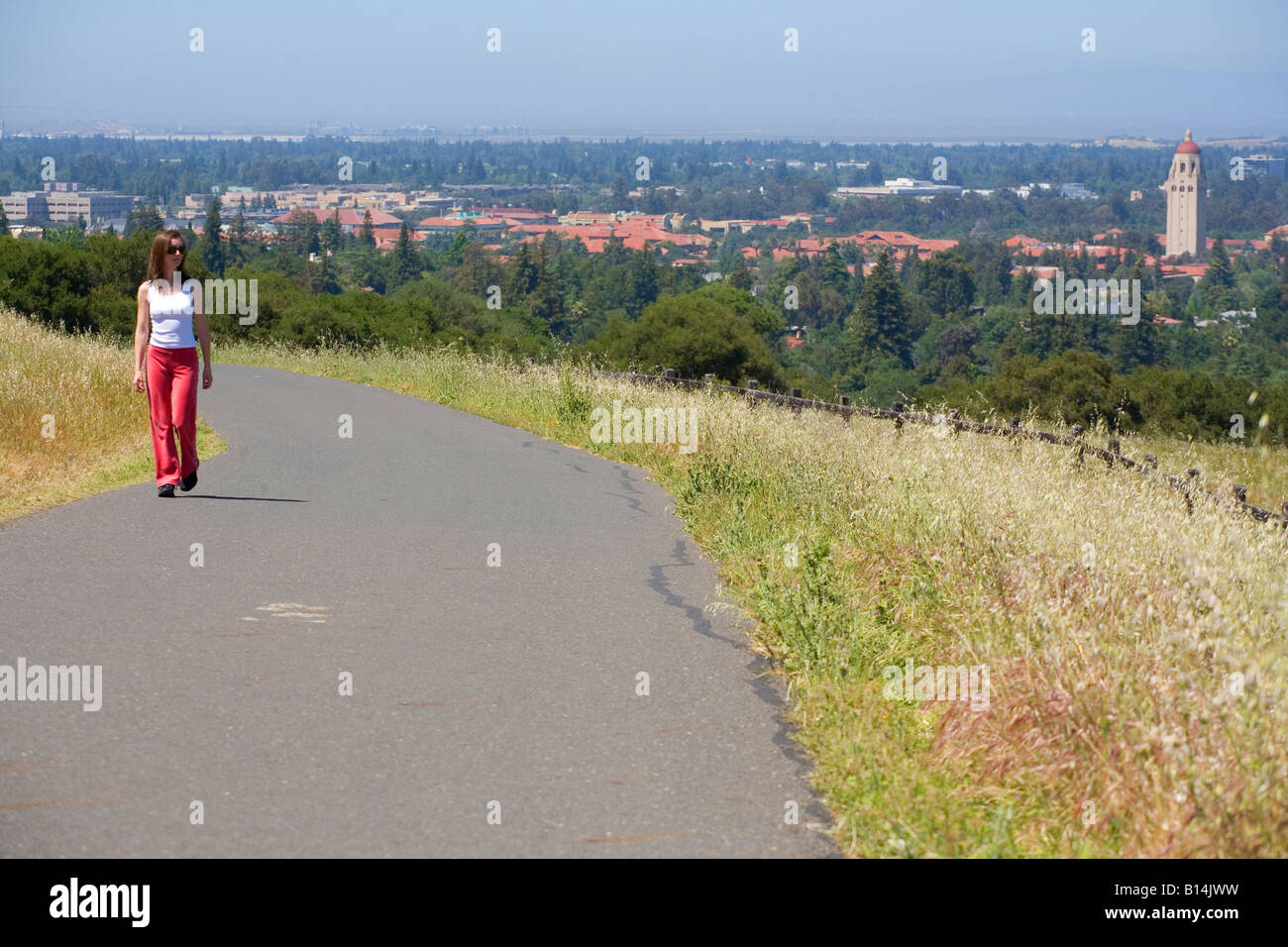 beautiful girl walking on a recreation path Stock Photo - Alamy