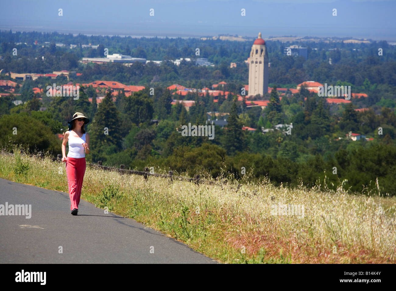 beautiful girl walking on a recreation path Stock Photo - Alamy