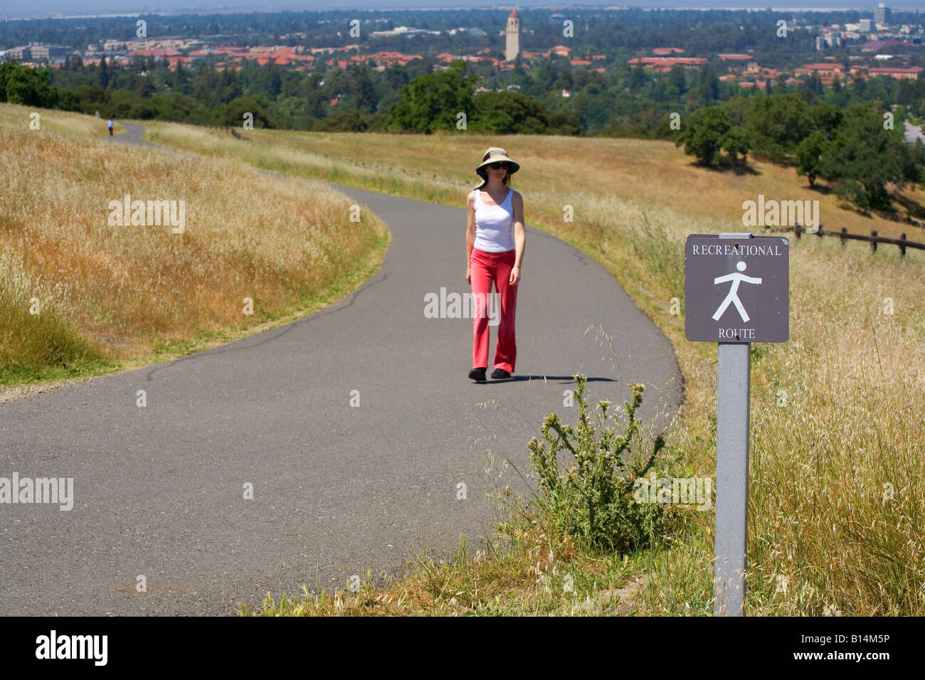beautiful girl walking on a recreation path Stock Photo - Alamy