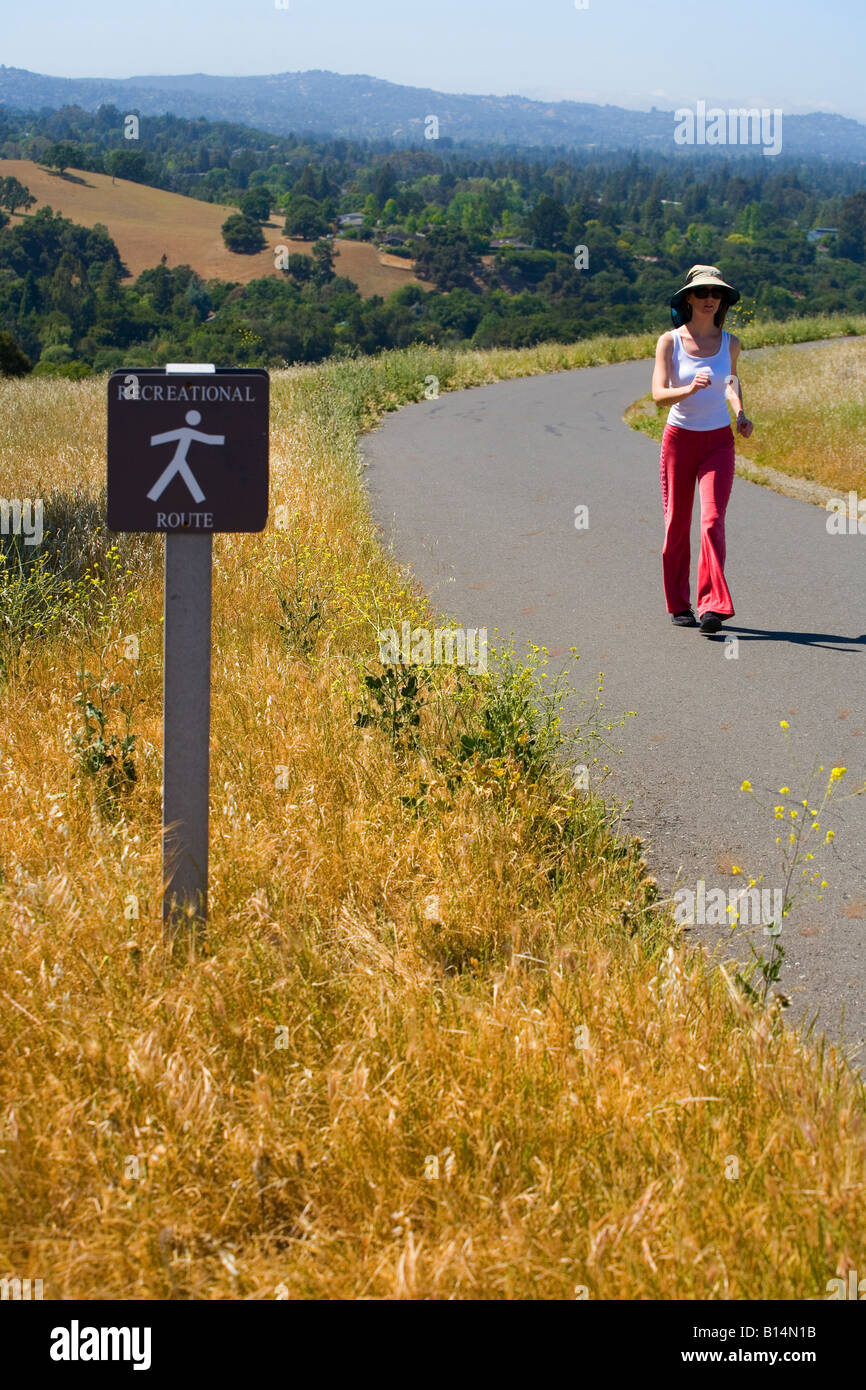 beautiful girl walking on a recreation path Stock Photo - Alamy