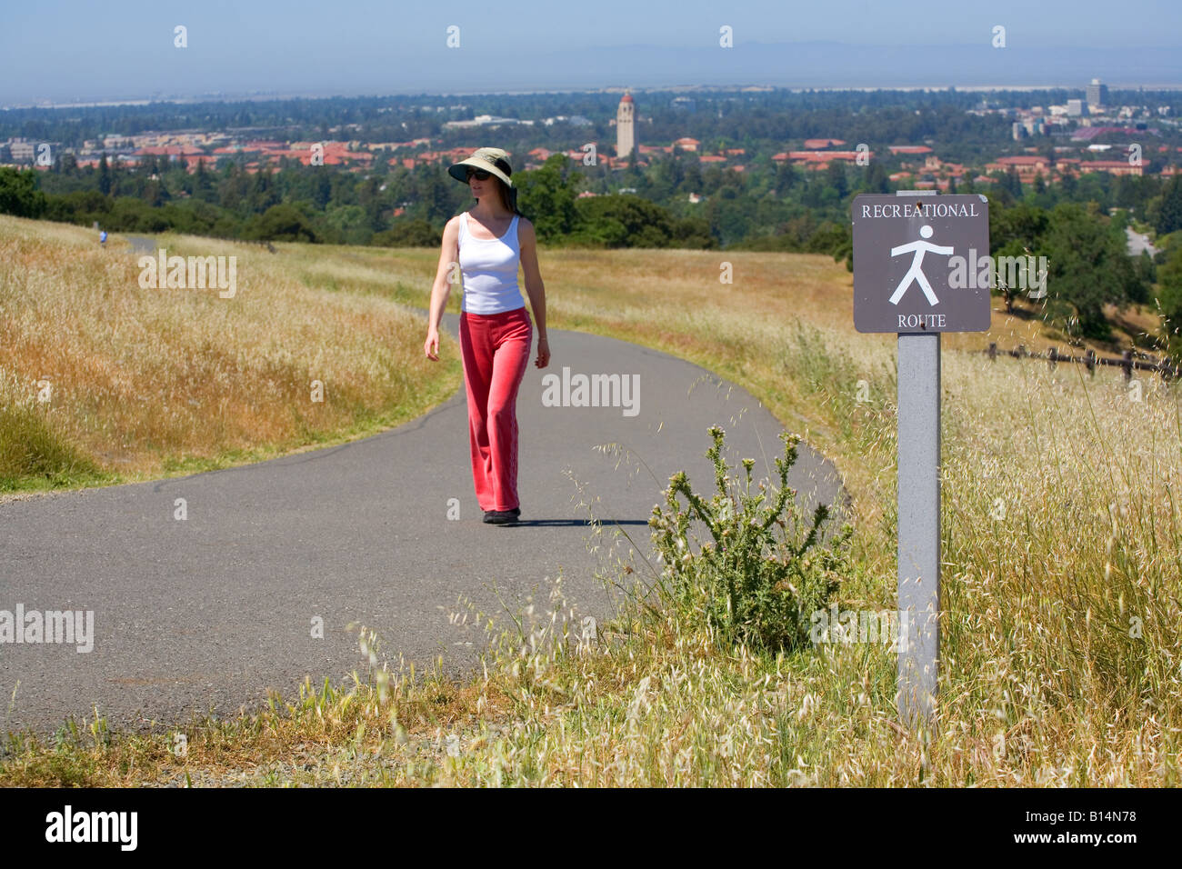 beautiful girl walking on a recreation path Stock Photo - Alamy
