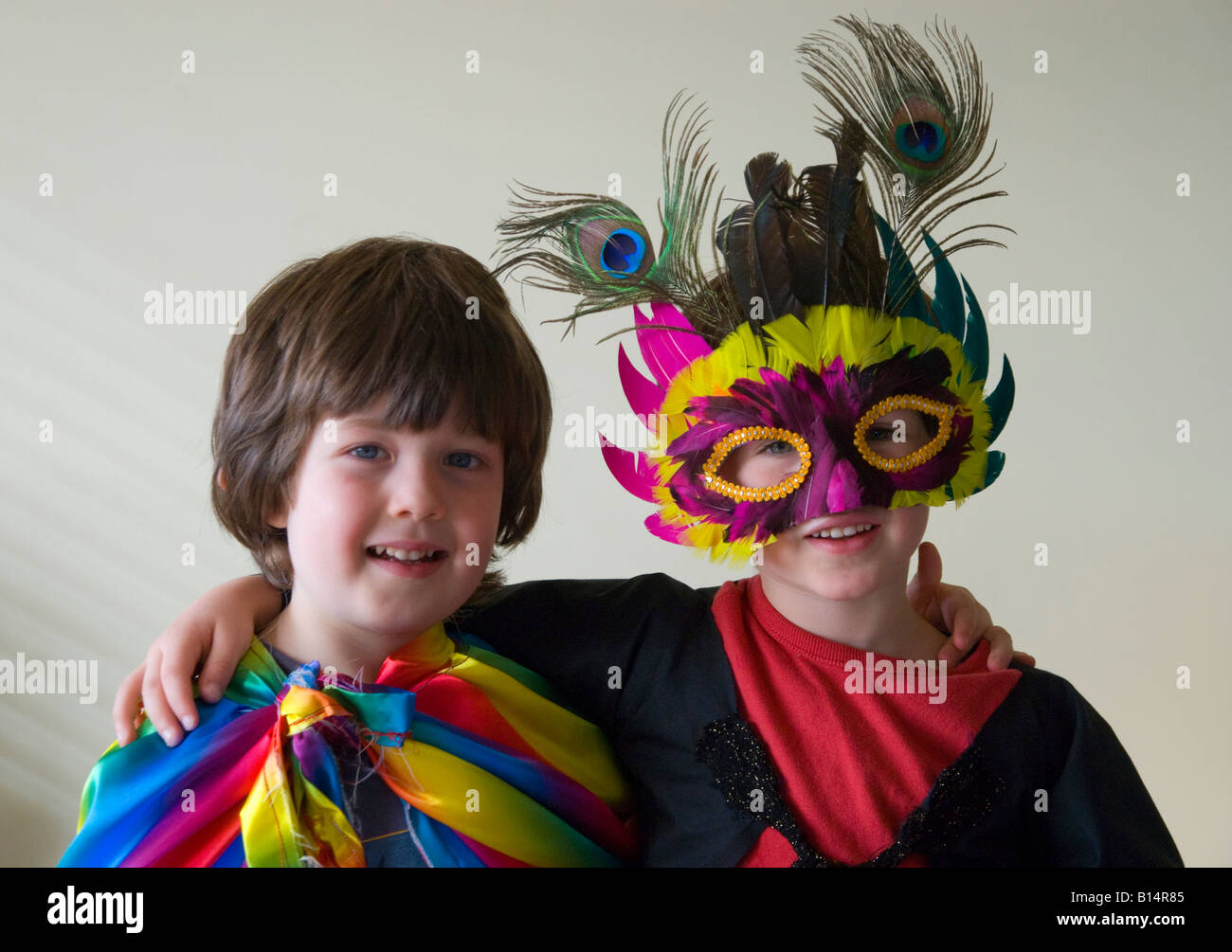 Two young friends wearing rainbow coloured clothing for fancy dress up ...