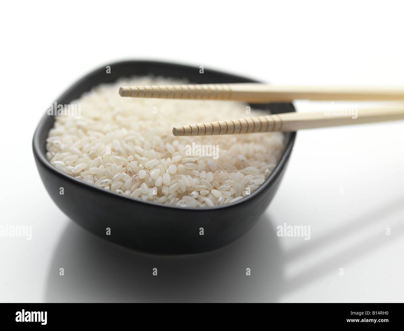 grain rice wood chopstick black bowl oriental Stock Photo - Alamy