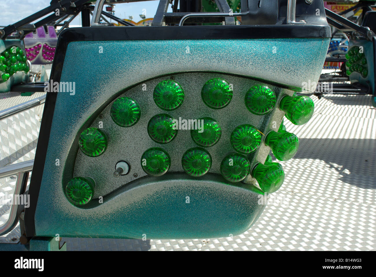 Fairground ride seat with green coloured lights Stock Photo - Alamy