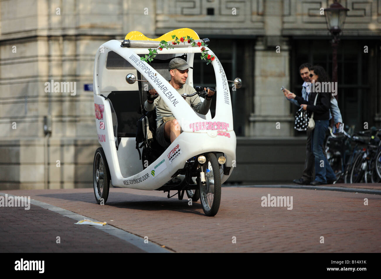 Tricycle taxi, with solo driver, in Amsterdam Stock Photo - Alamy