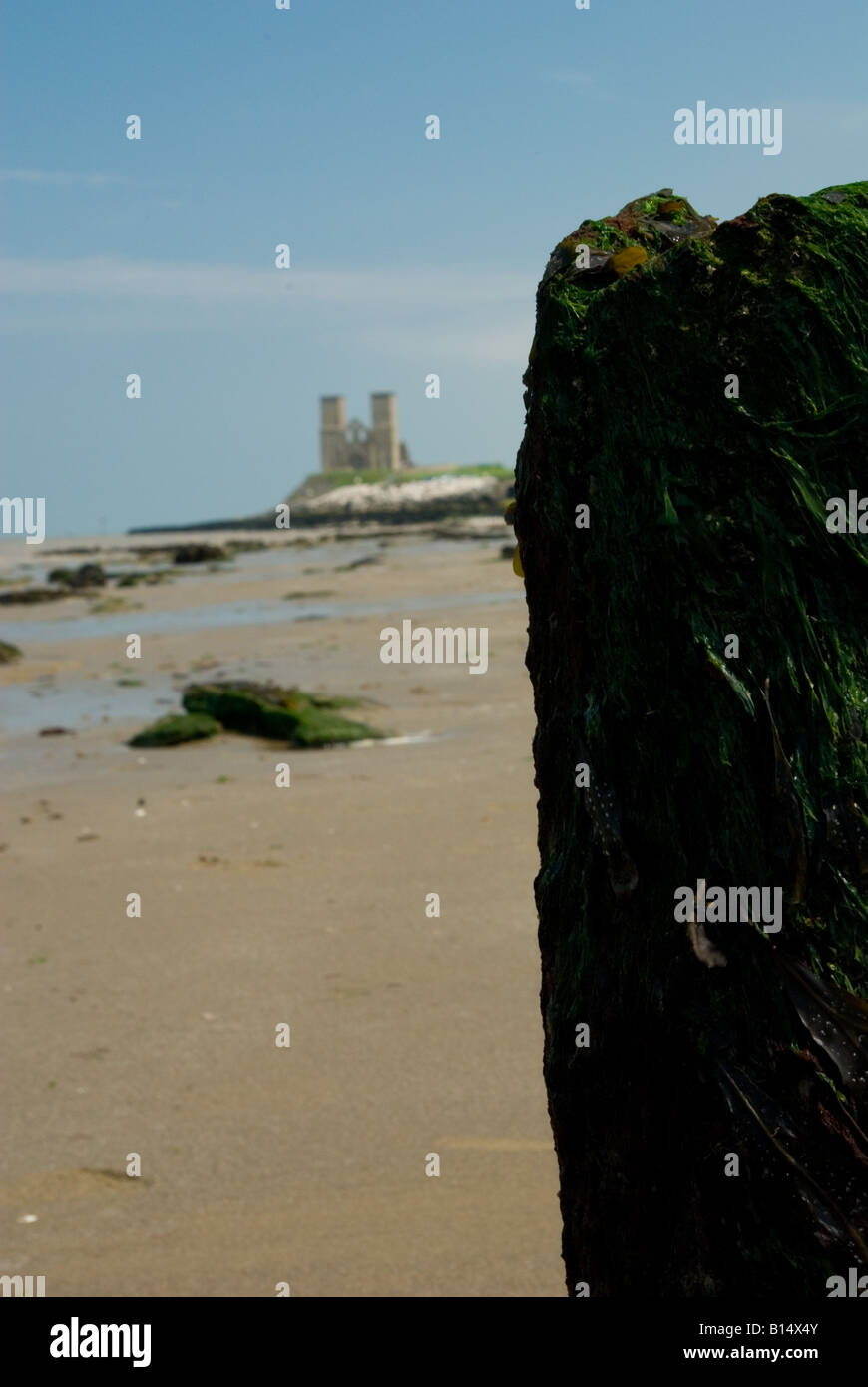 Reculver beach with castle in background Stock Photo - Alamy