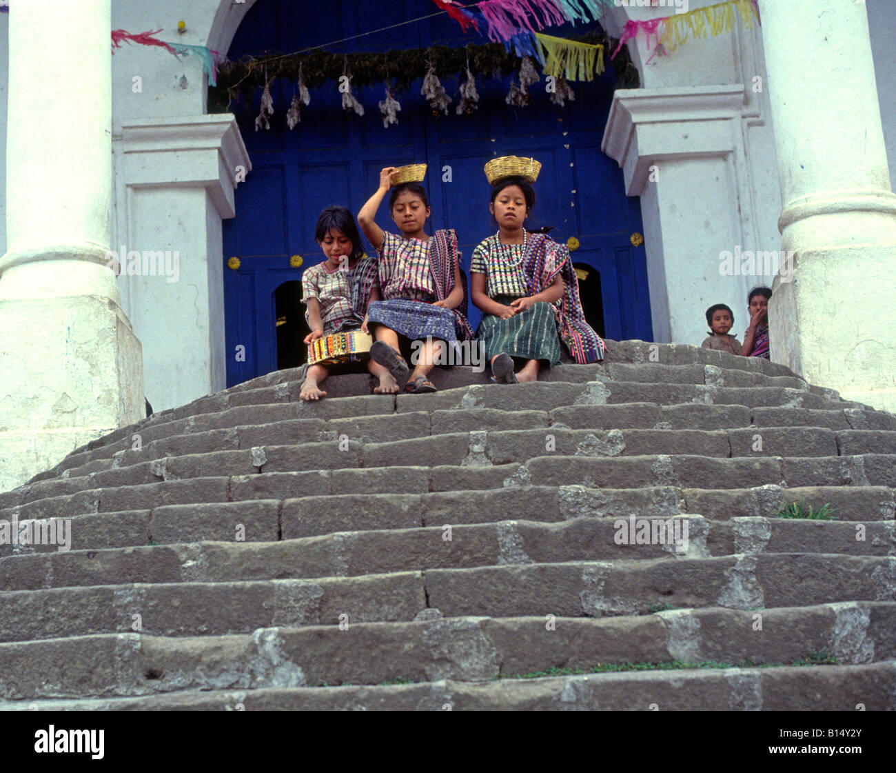 Mayan children sitting on church steps Santiago Atitlan, Guatemala ...