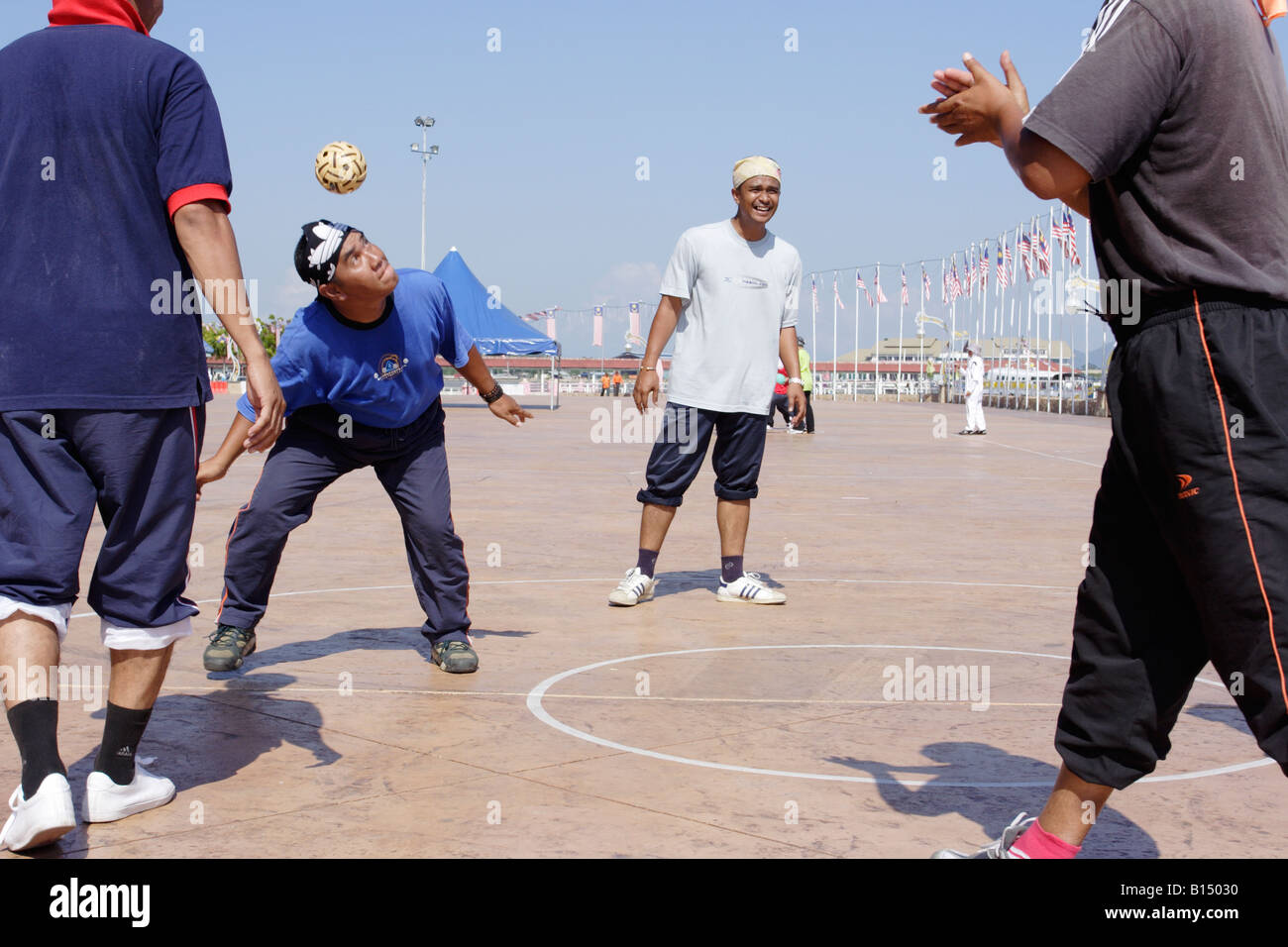 Playing traditional Malay game of Sepak Raga in Terengganu, Malaysia ...
