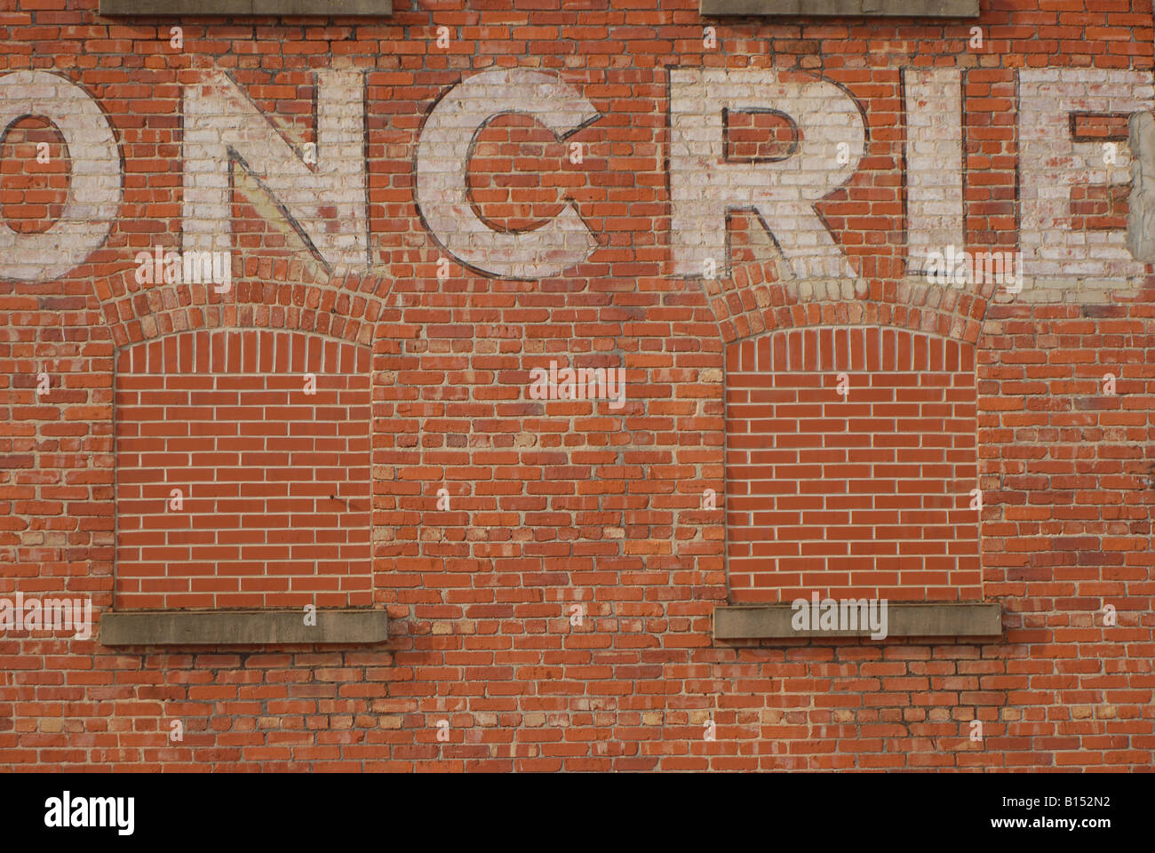 Old brick building with bricked over windows Stock Photo - Alamy