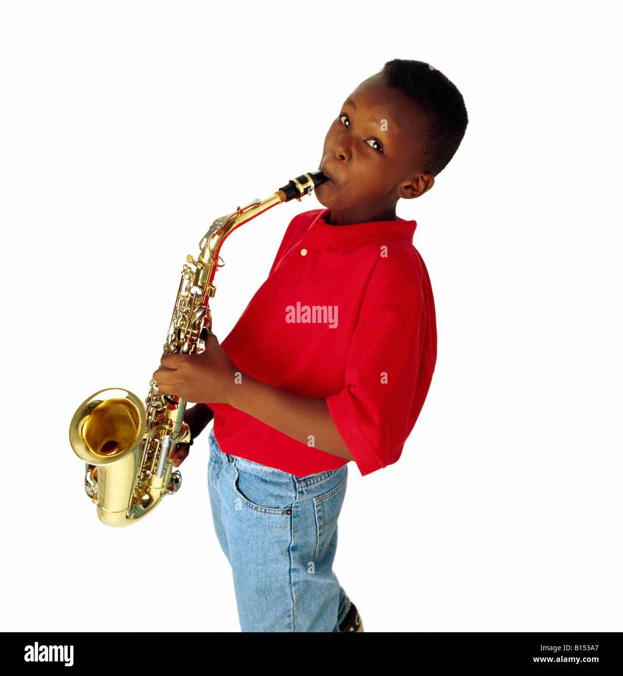 Boy playing the saxophone Stock Photo - Alamy