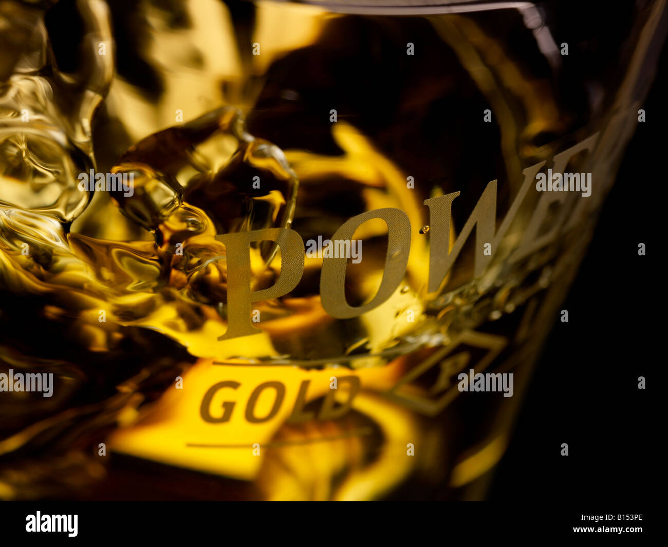 Close up of whiskey pouring Stock Photo - Alamy
