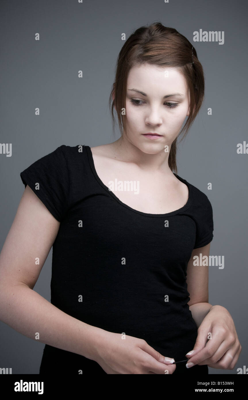 moody teenage girl looking sad and depressed Stock Photo - Alamy