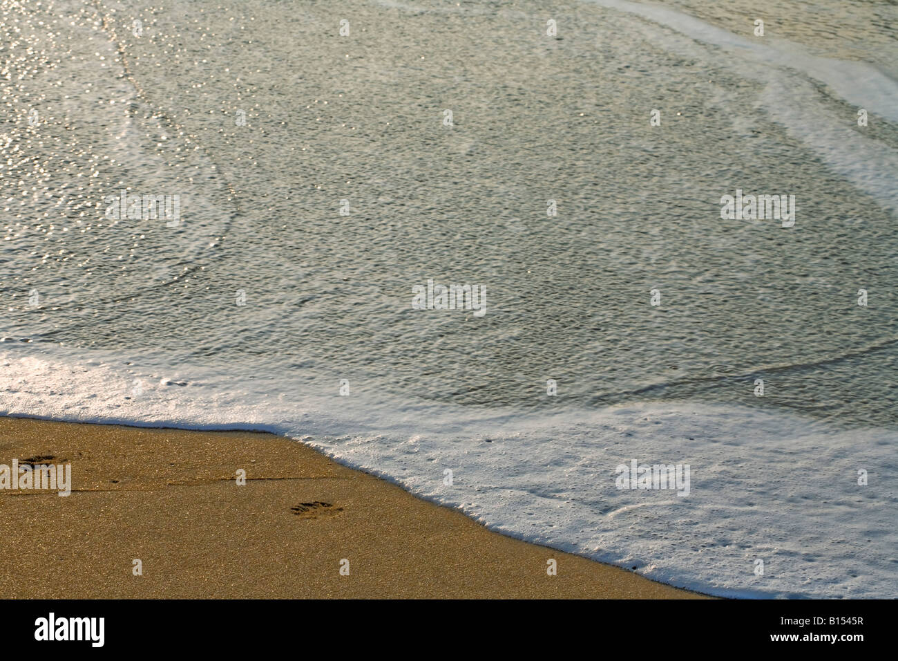 Sandy beach on sea waves hi-res stock photography and images - Alamy