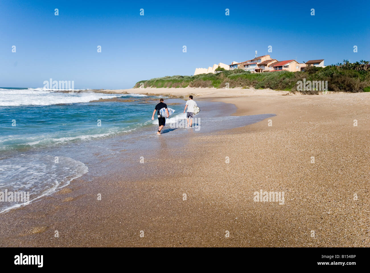 Shelly beach surfers Stock Photo - Alamy