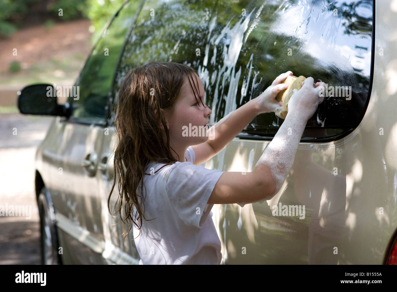 Young girl washes family car Stock Photo - Alamy