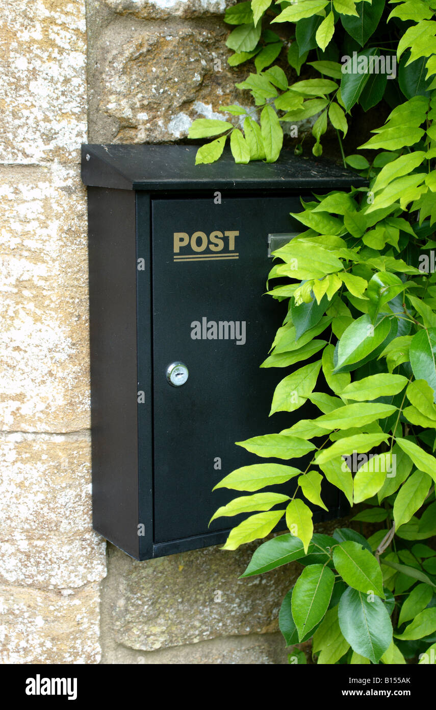 Mail box on a house wall Stock Photo - Alamy