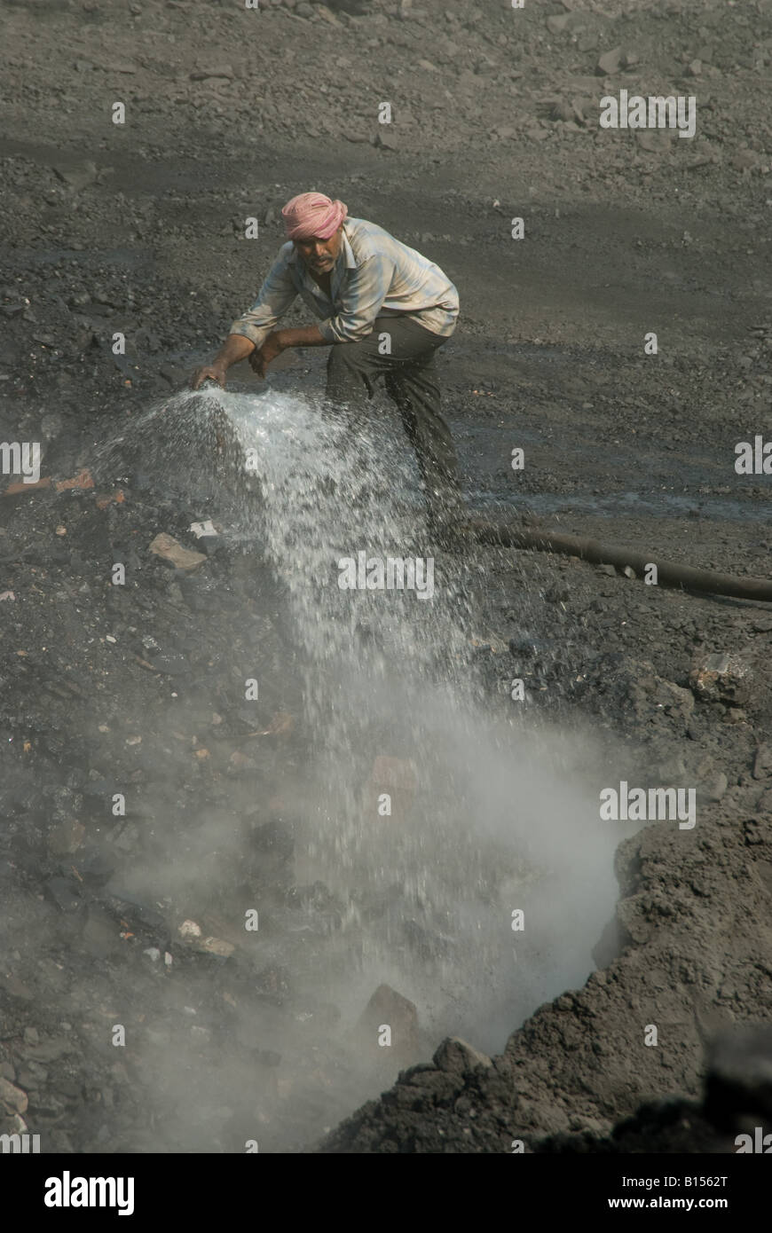 Water is poured onto coal to to stop it s slow burning during the ...
