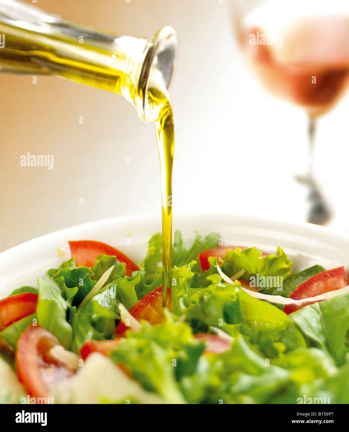 Pouring oil onto salad hi-res stock photography and images - Alamy