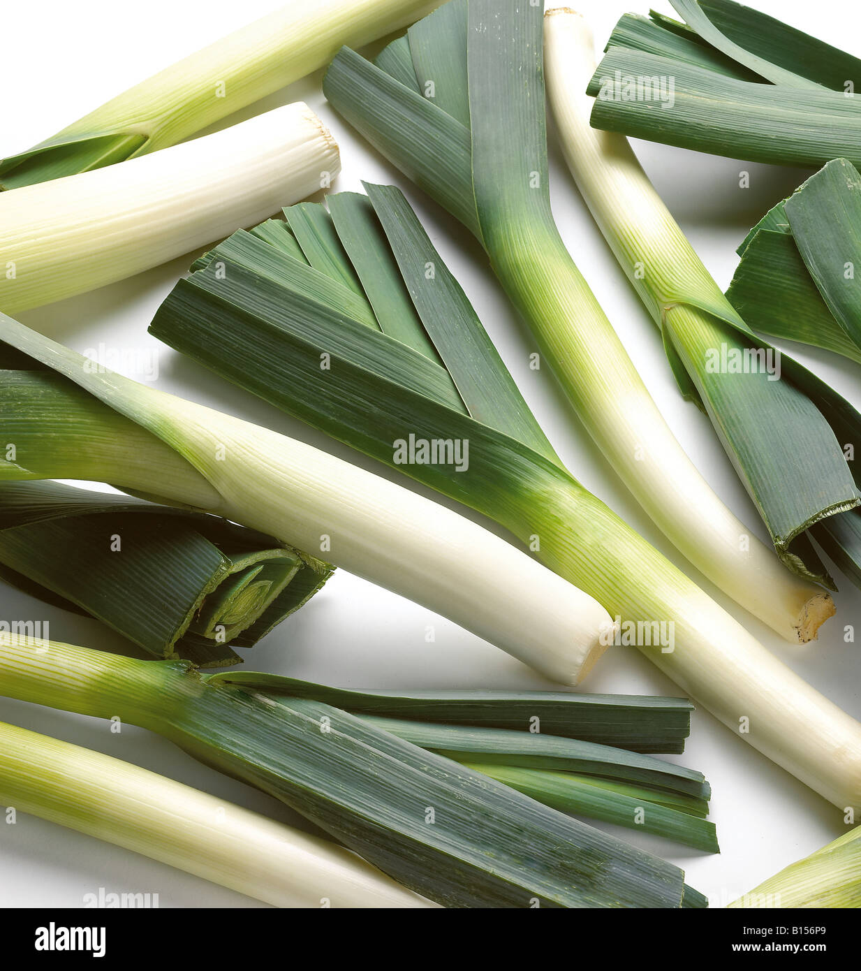 Leeks on white paper Stock Photo - Alamy