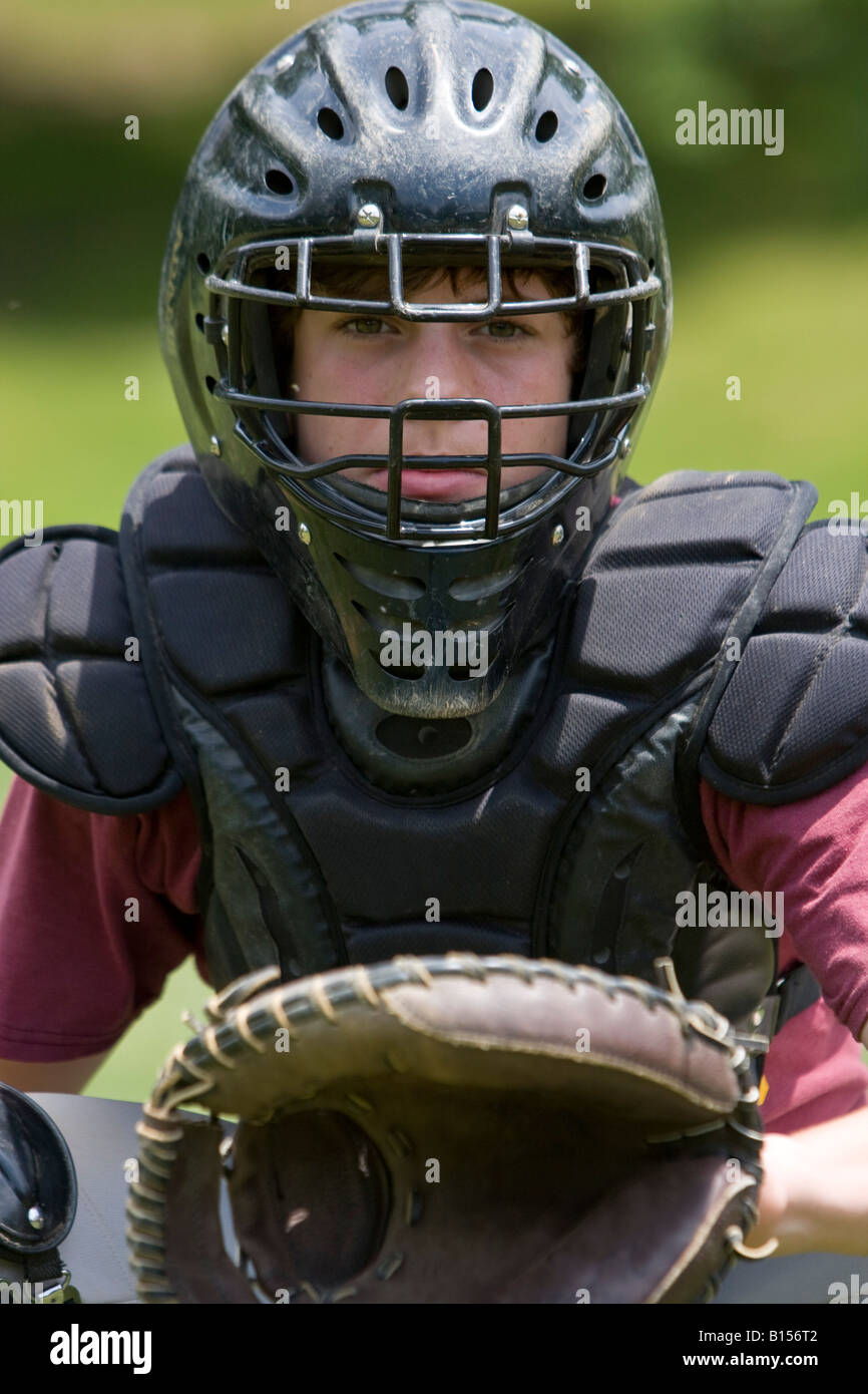 Teenager in baseball catcher gear, portrait outdoors, Washington DC ...