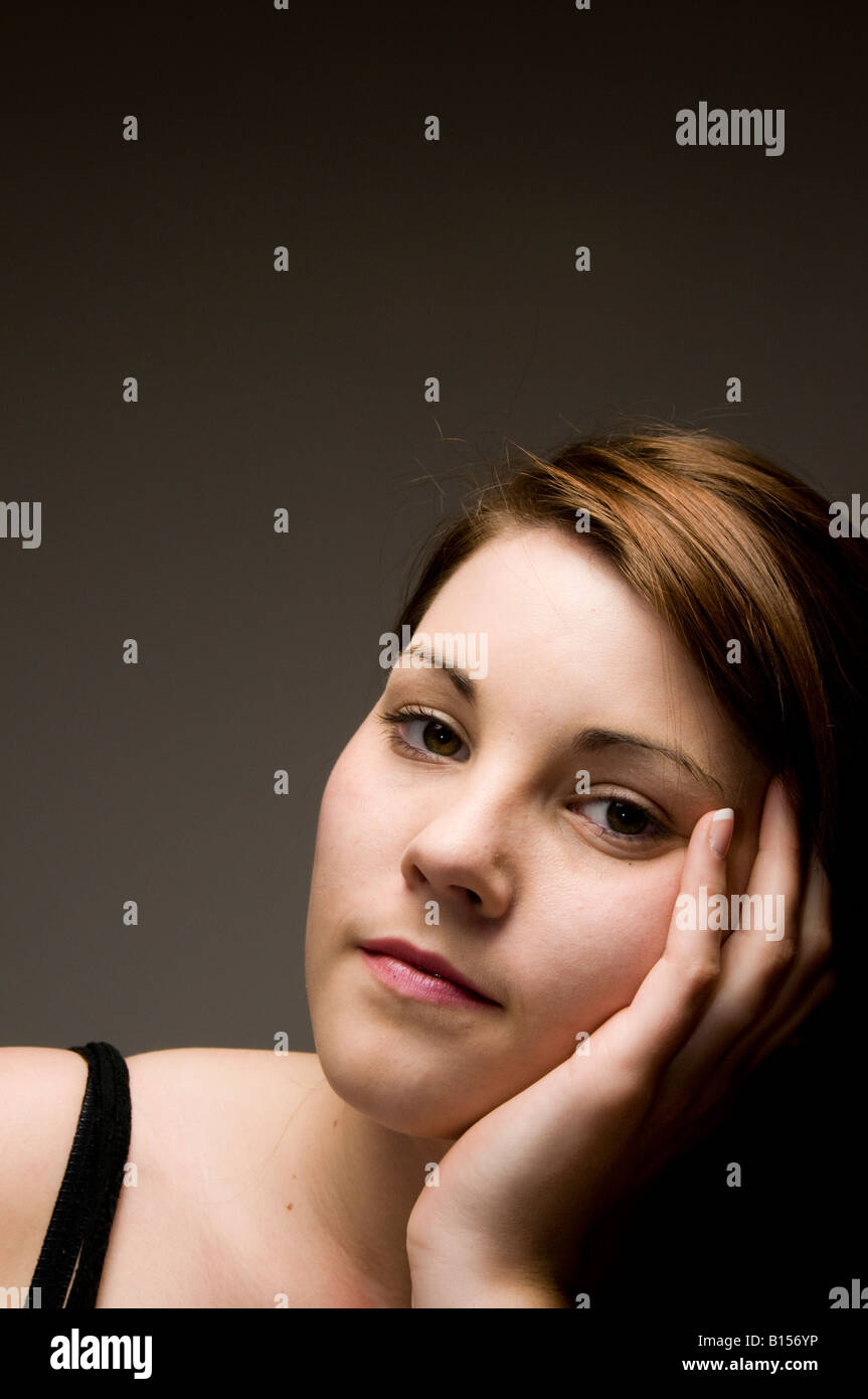 attractive slim english welsh teenage girl in studio, looking bored ...