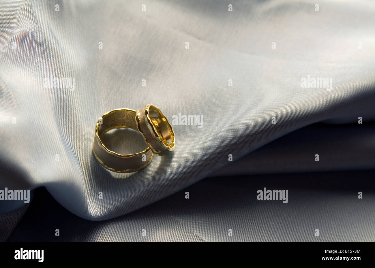 Beautiful unique wedding rings on a silk pillow Stock Photo - Alamy