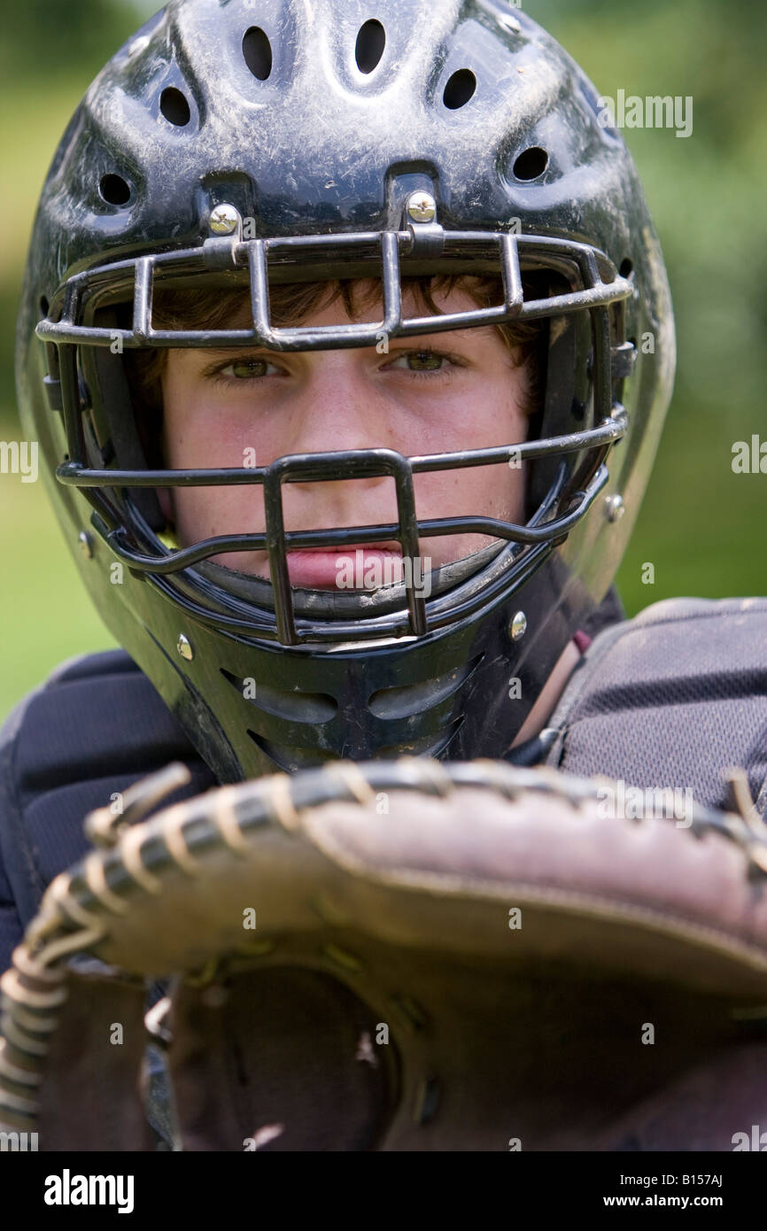 Teenager in baseball catcher gear, portrait outdoors, Washington DC ...