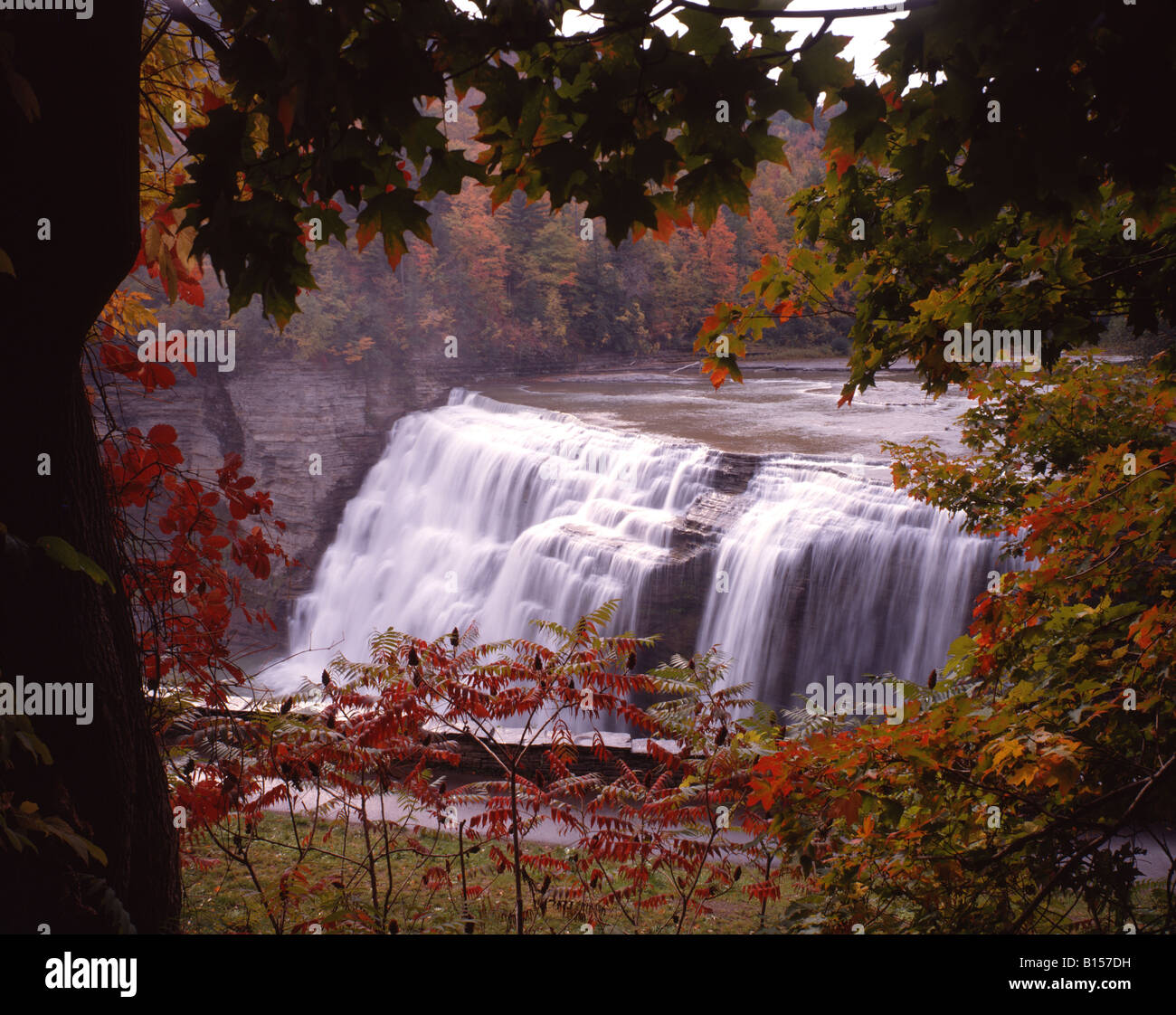 Waterfall Framed by Autumn Foliage Stock Photo - Alamy