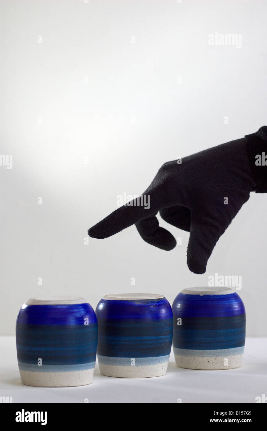 Three cups magic trick hi-res stock photography and images - Alamy