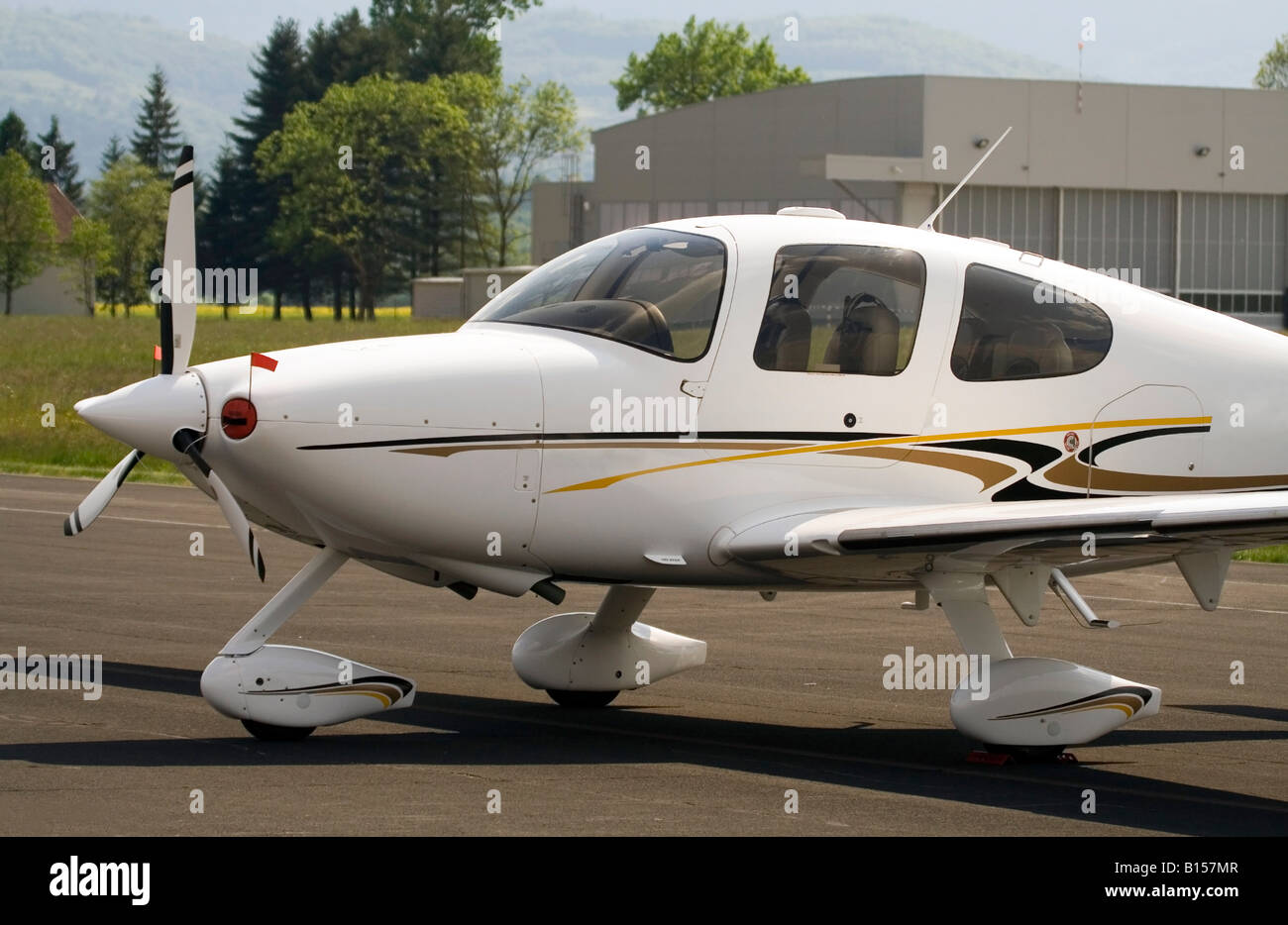 Small airplane parked on a runway Stock Photo - Alamy
