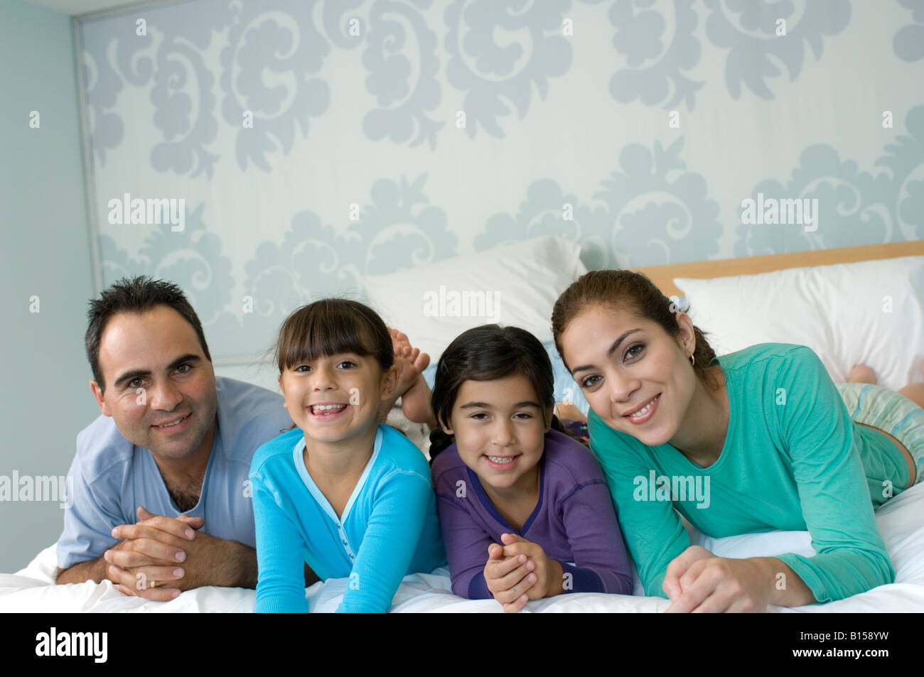 Family at home Stock Photo - Alamy