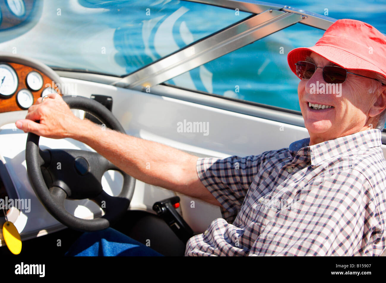 Senior man boating Stock Photo - Alamy