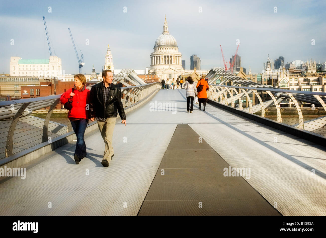 People crossing the Millennium Bridge London Stock Photo - Alamy
