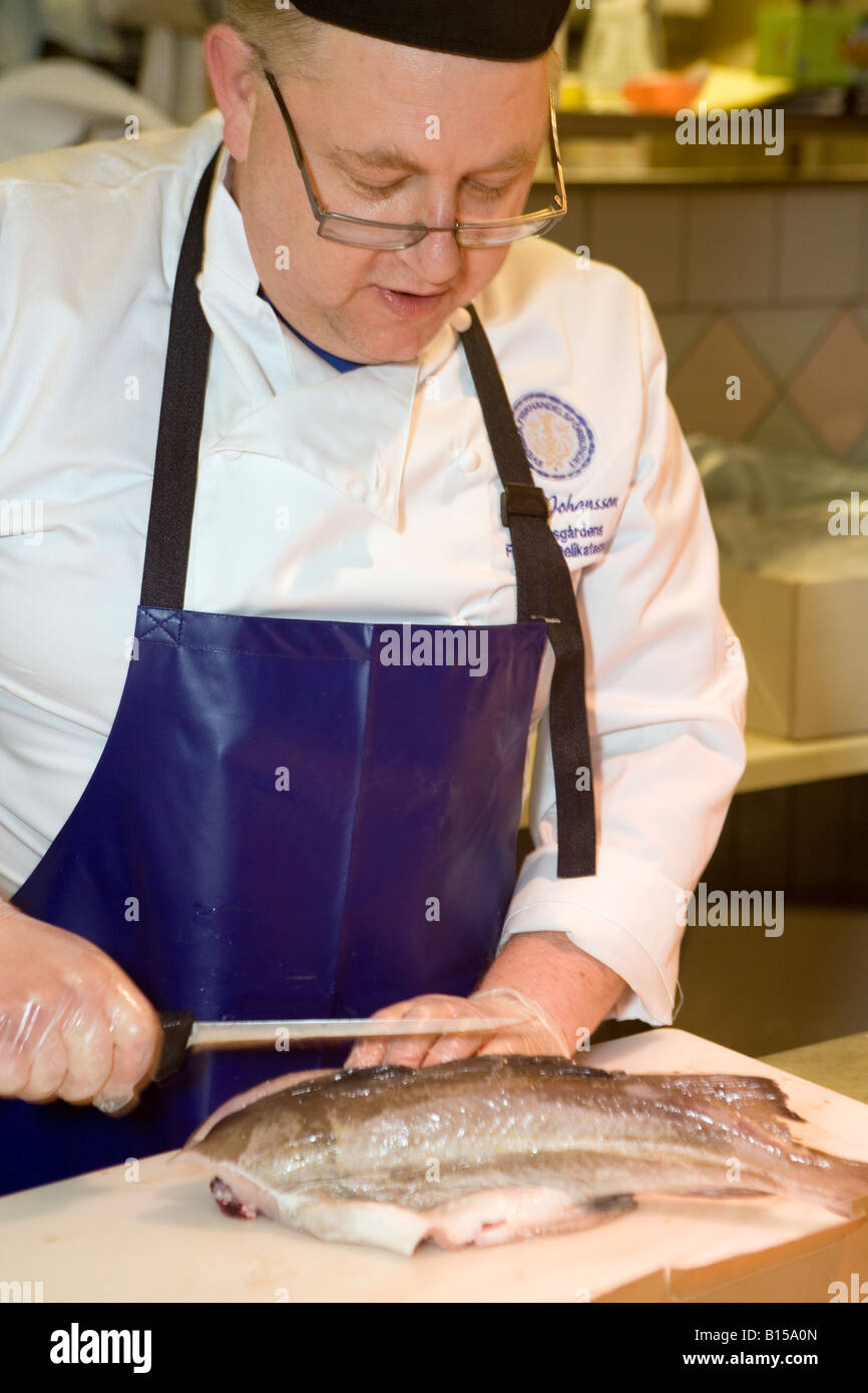 Chef and fishmonger Nils Johnson slicing a codfish during competition ...