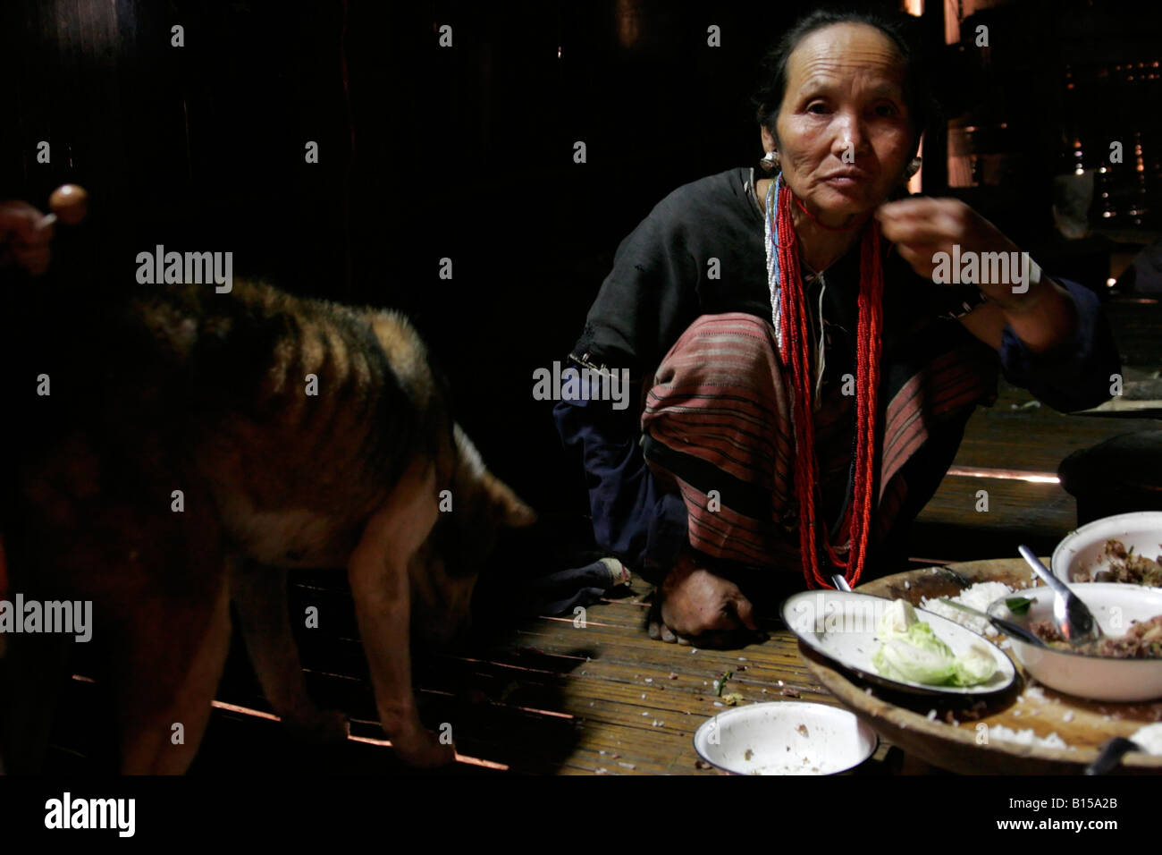 Karen woman sitting on the floor of the traditional Karen house in the ...