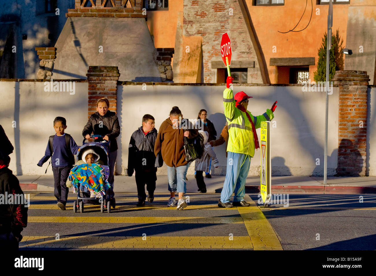 Children crossing street guard hi-res stock photography and images - Alamy