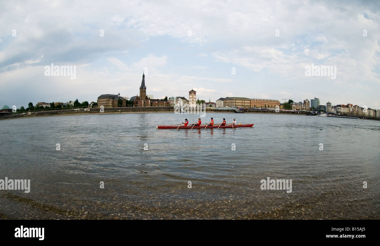 scullers in their rowboat on the Rhine river in Duesseldorf across ...