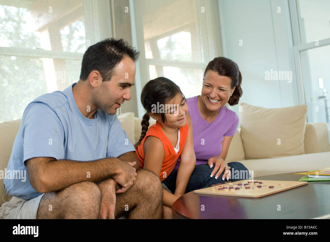Family playing at home Stock Photo - Alamy