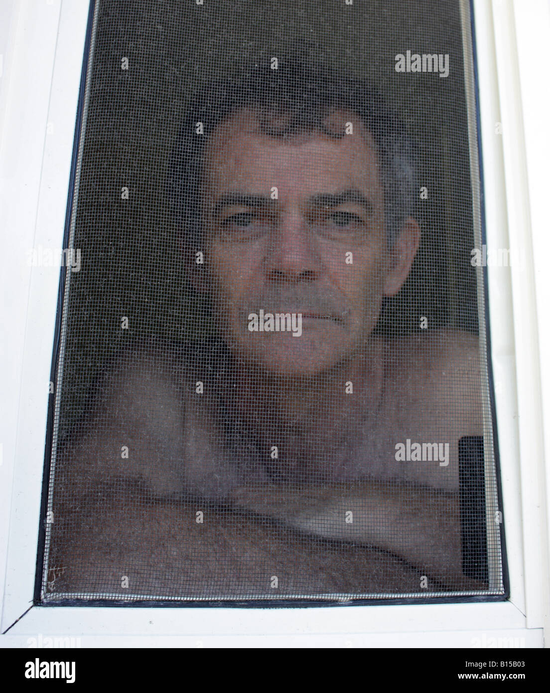 PORTRAIT OF A MAN IN HIS FIFTIES LOCKED UP AND LOOKING MENTALLY ...