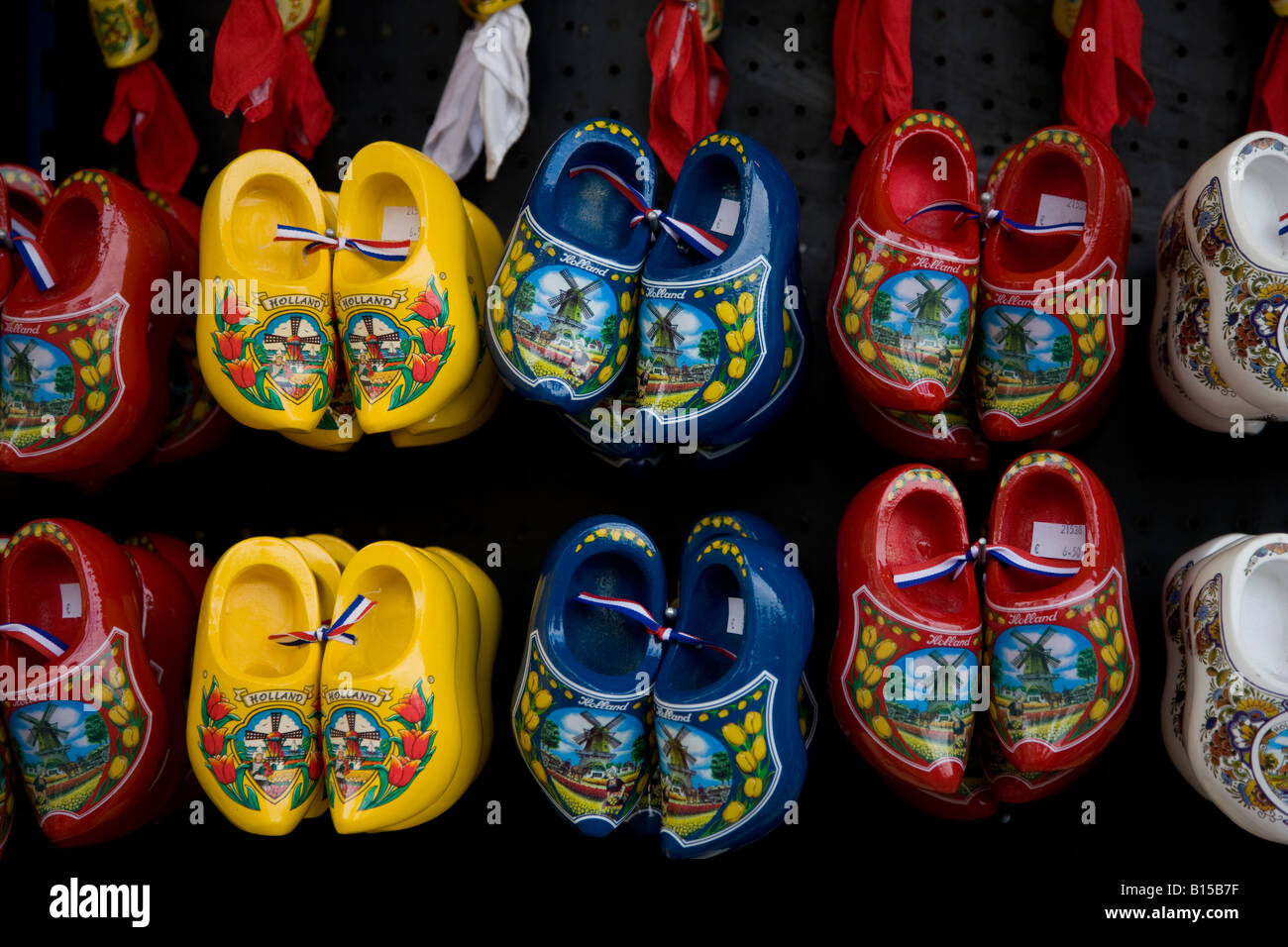 Painted clogs hang in a shop display Stock Photo - Alamy