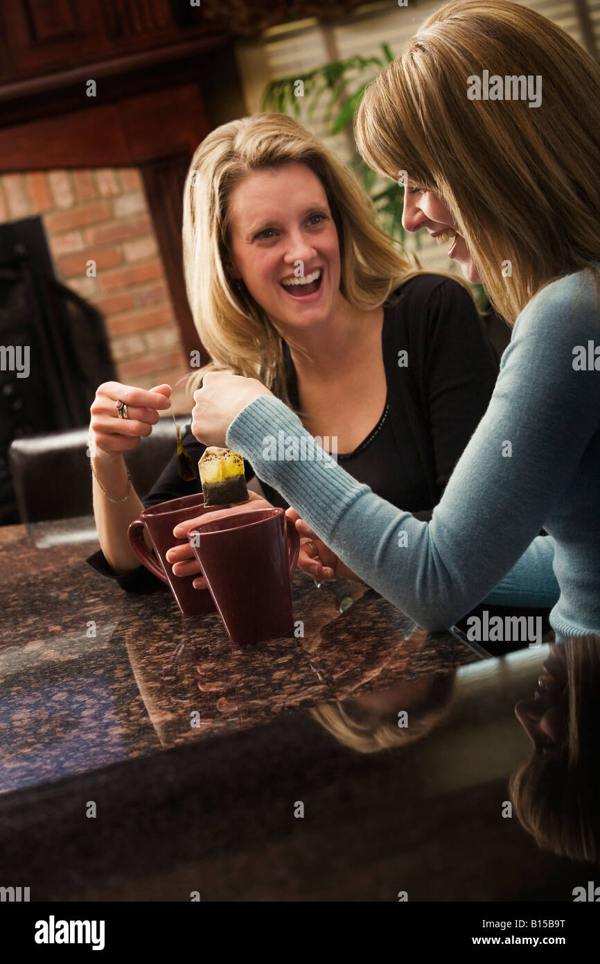 Girlfriends talking over tea Stock Photo - Alamy