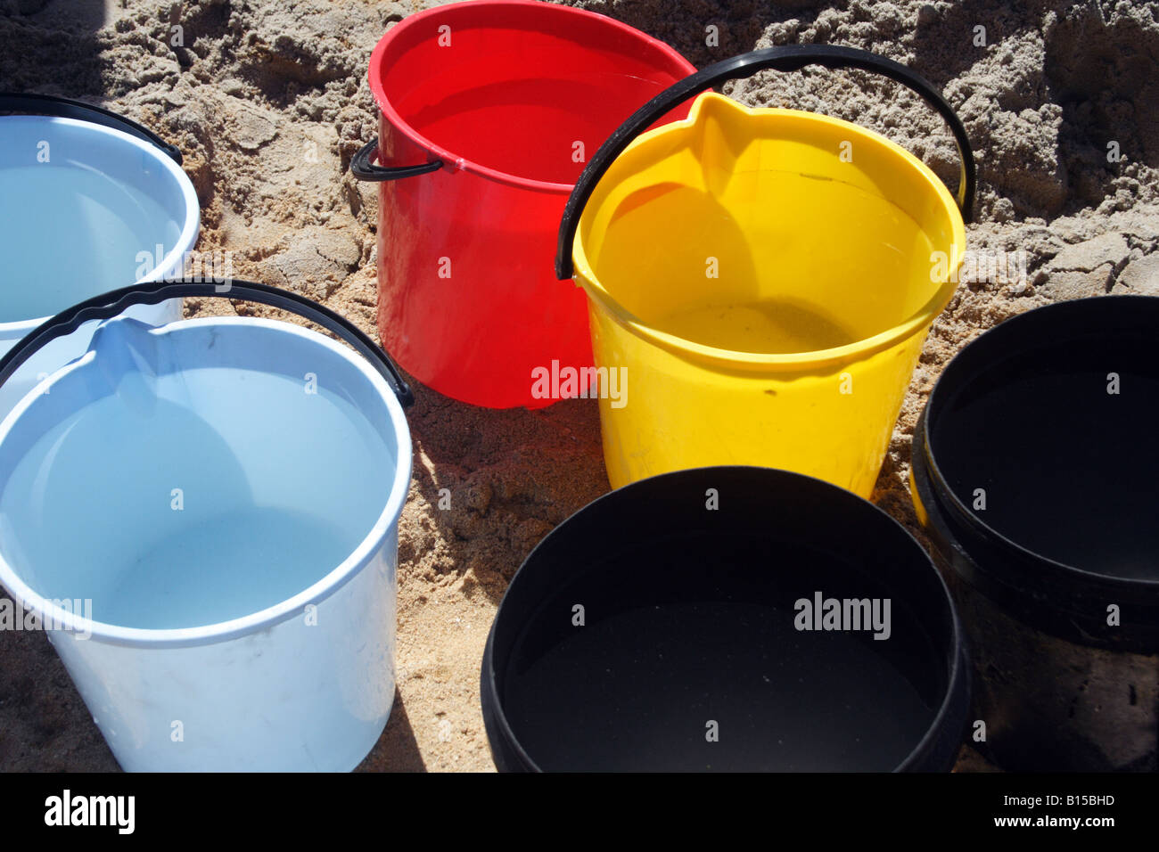 BUCKETS ON A SANDY BEACH TOP VIEW HORIZONTAL BDA10058 Stock Photo - Alamy