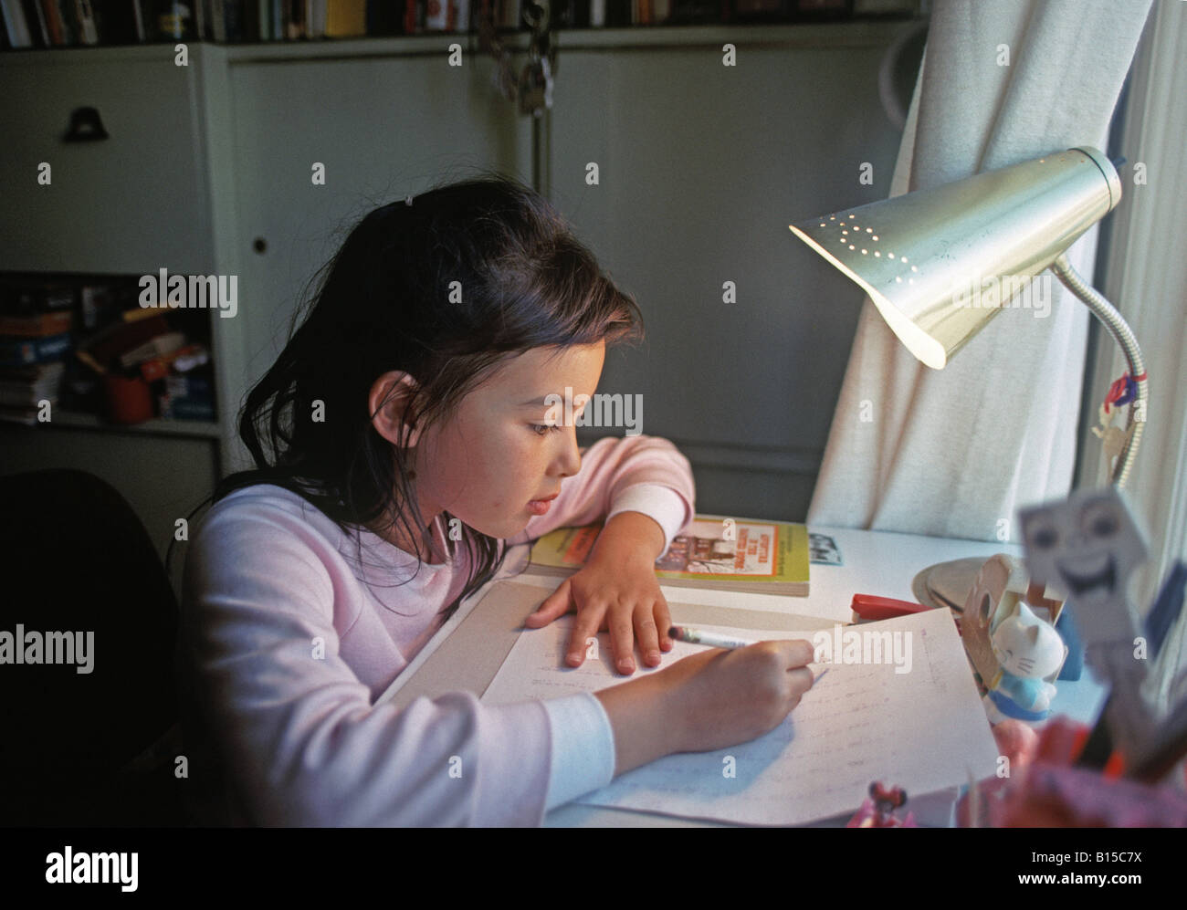 girl does her math homework at home Stock Photo - Alamy