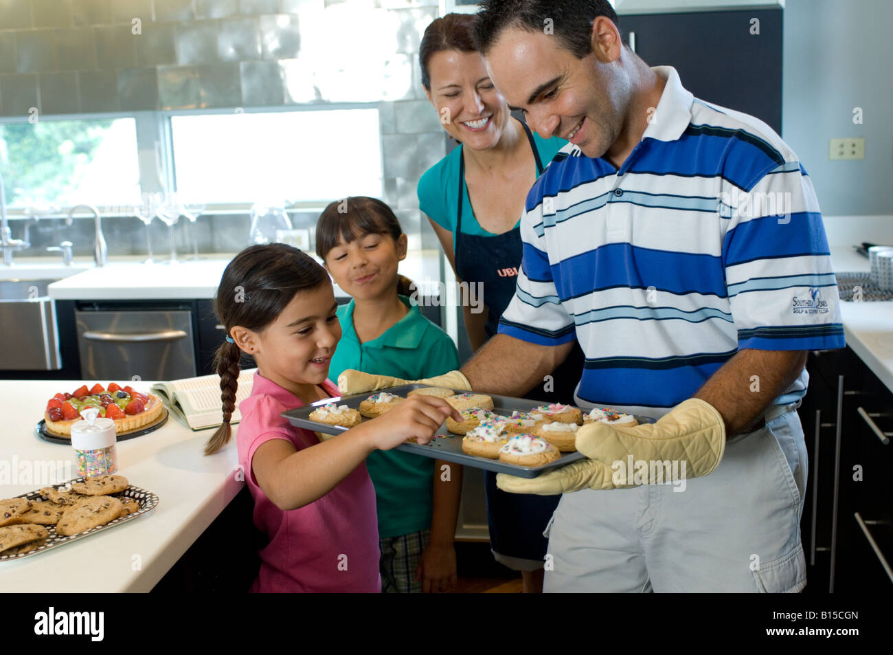 father baking pastry with kids Stock Photo - Alamy