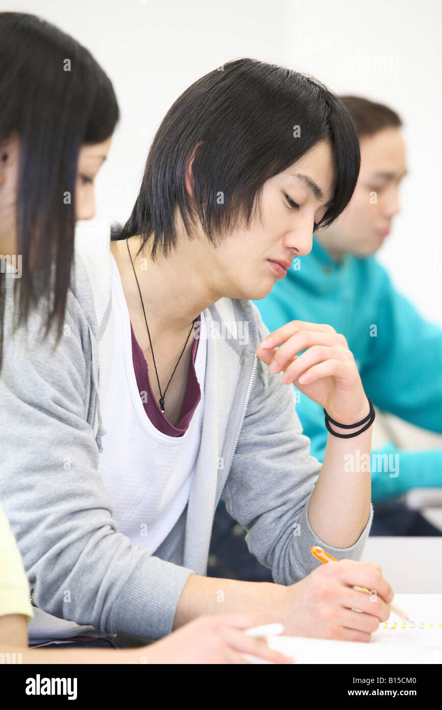 Japanese student taking a memo Stock Photo - Alamy