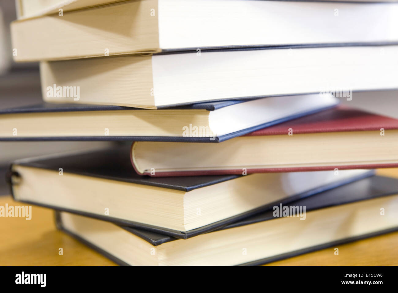 Books piled on the table Stock Photo - Alamy