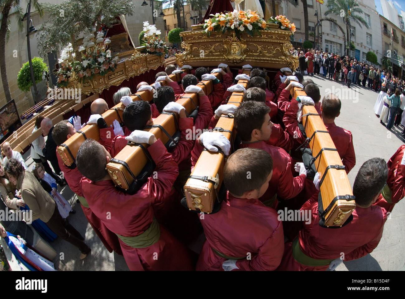 Penitents carry religious statues during Easter Procession in ...