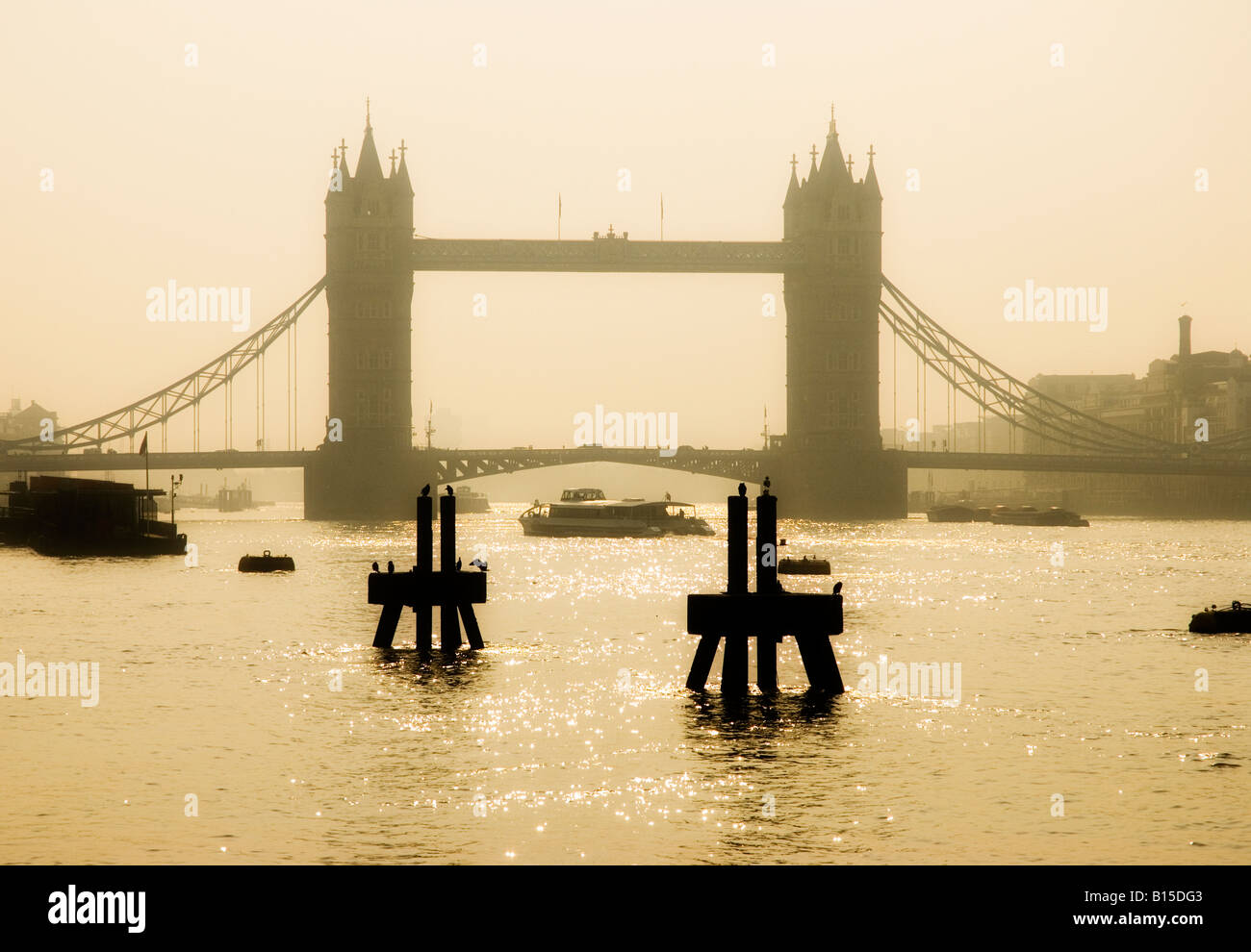 Tower Bridge partially silhouetted on a misty morning Stock Photo - Alamy
