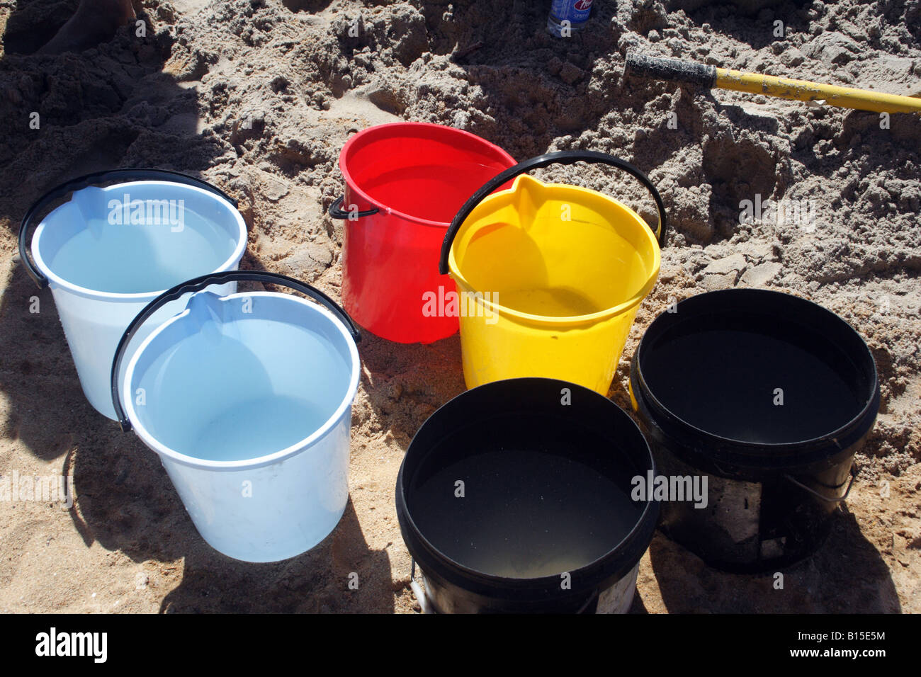 BUCKETS ON A SANDY BEACH TOP VIEW HORIZONTAL BDA10057 Stock Photo - Alamy