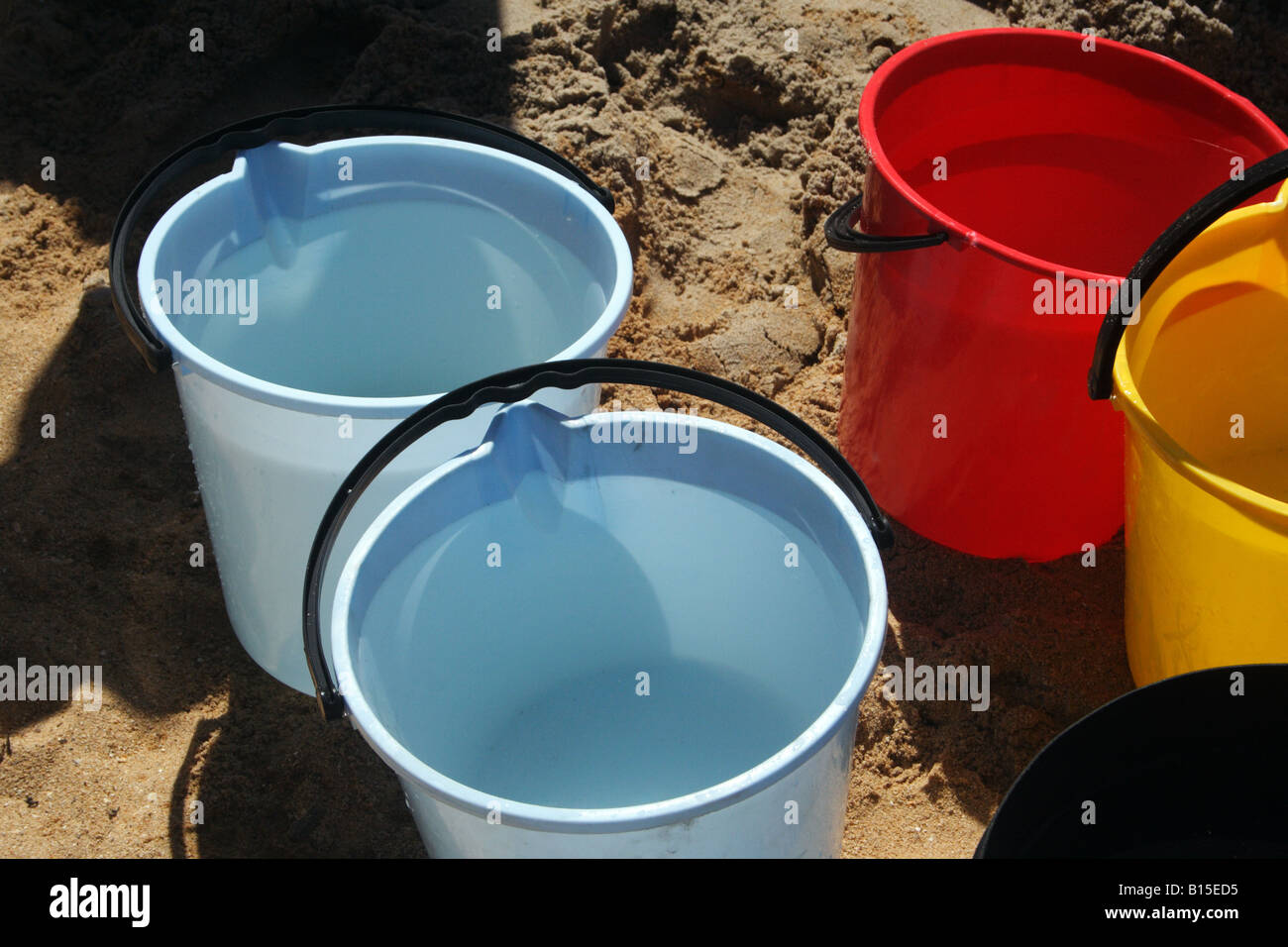 BUCKETS ON A SANDY BEACH TOP VIEW HORIZONTAL BDA10056 Stock Photo - Alamy